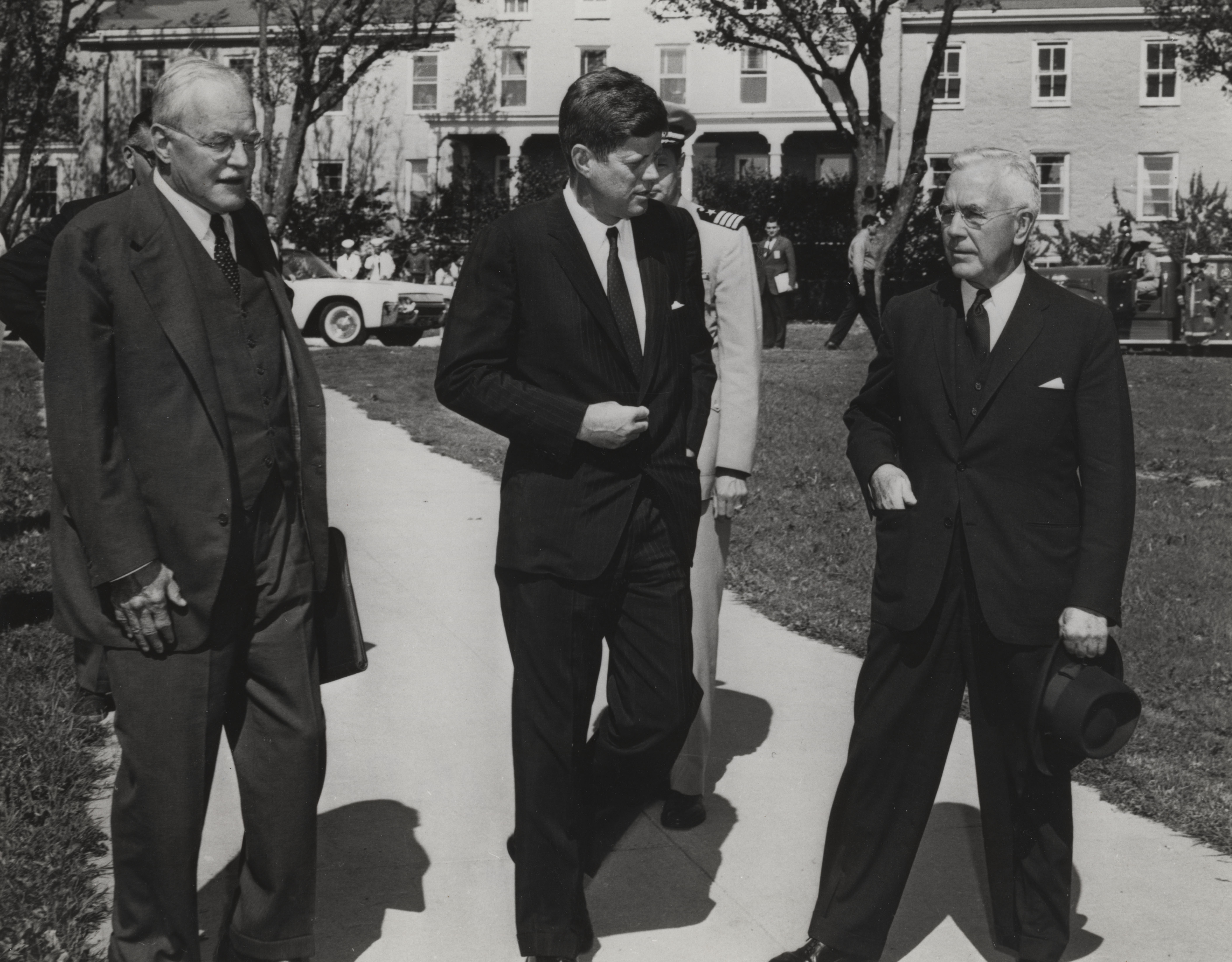 Allen Dulles, John F. Kennedy and John A. McCone in front of Founders ...